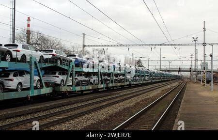 Double deck car carrier wagons with new Skoda cars passes through Lysa ...