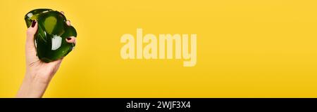 object photo of delicious green jello in hand of unknown female model ...