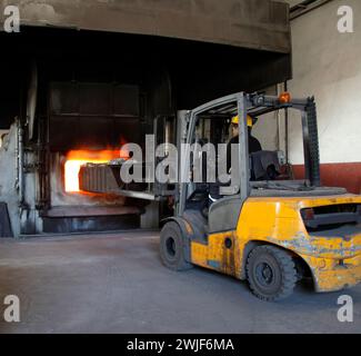 Carrying molten metal in forklift Stock Photo - Alamy