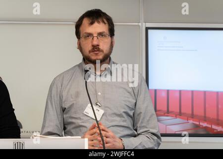 Israeli military technology expert Shir Hever (r) holds a press ...