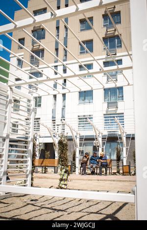 Stone-paved courtyard with trees, bushes, brick apartment buildings ...