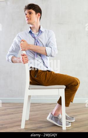 Physical jerks for office workers on chair Stock Photo - Alamy