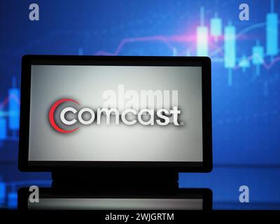 In this photo illustration, Comcast Corporation logo seen displayed on ...