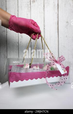 Homemade zephyr or marshmallows in a box on a pink background, Top view ...