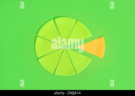 Composition with segments of paper circle on green background. Concept ...