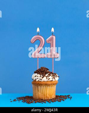 Chocolate cupcake with candle number 21 - Birthday on industrial ...