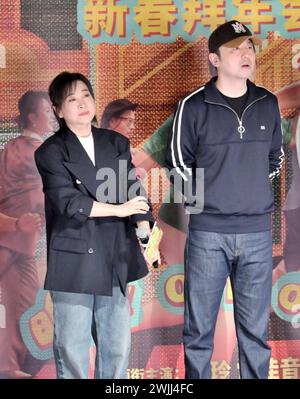 SHANGHAI, CHINA - FEBRUARY 14, 2024 - Fans pass posters of the movie ...