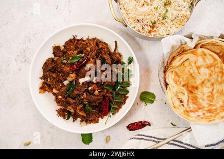 Kerala beef fry roast served with parotta and ghee rice - Malabar Iftar ...