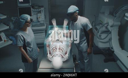 Diverse surgeons in AR headsets work in operating room using futuristic ...