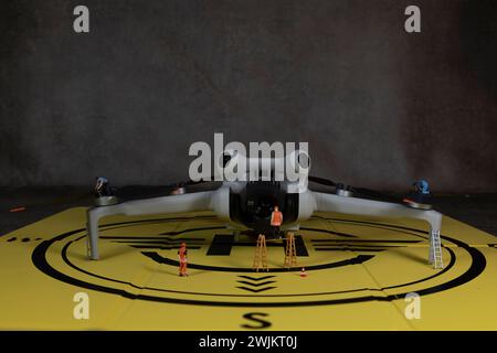 miniature figures checking the working of the drone propeller Stock ...