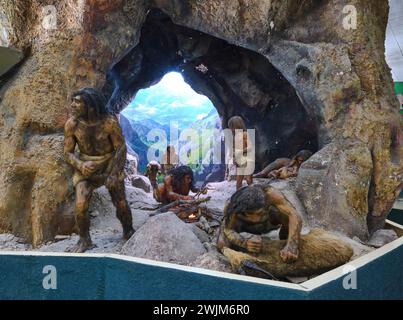 A tribe starts a fire. Detail of a paleolithic, stone age, cave man ...