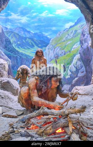 A tribe starts a fire. Detail of a paleolithic, stone age, cave man ...