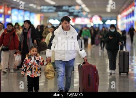 URUMQI, CHINA - FEBRUARY 16, 2024 - Tourists ride a train back to ...