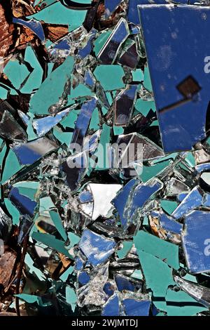 Abstract blue broken glass with a lot of cracks shot window against sea ...