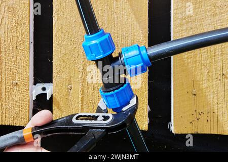 Installation of watering system from HDPE pipes, two parts of water ...