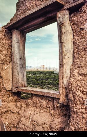The window of an old ruin at Hot Springs frames the desert landscape in ...
