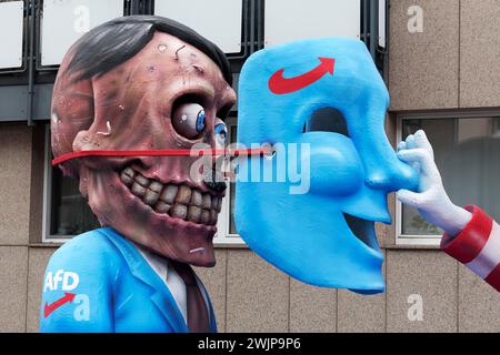 Behind the mask of the AFD is the skull of Hitler, papier-mache figures ...