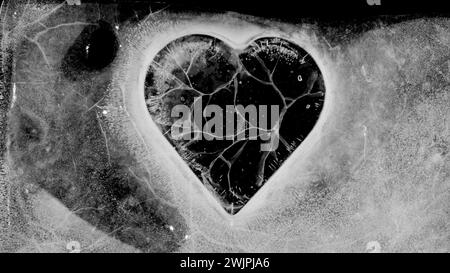Heart trapped in ice. Transparent heart trapped in ice. Cracking ...
