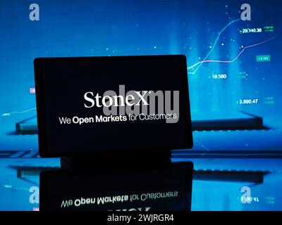 In this photo illustration, a StoneX Group Inc. logo seen displayed on ...