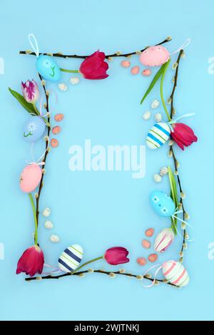 Easter willow wreath and blue Easter eggs on blue background. Top view ...