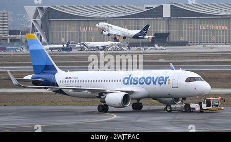 14 February 2024, Hesse, Frankfurt/Main: Passenger planes park on the ...