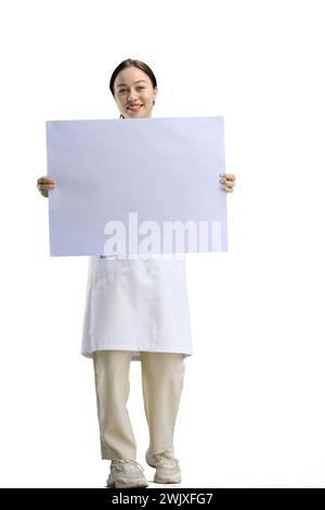 Young redhead doctor woman showing smartphone doing ok sign with ...