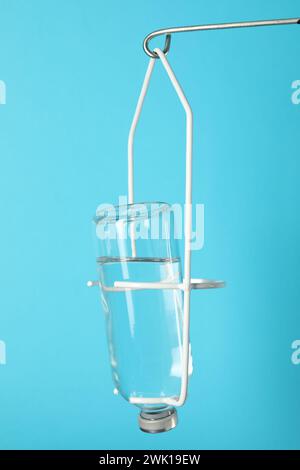 IV infusion set on light blue background Stock Photo - Alamy