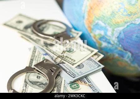 Map of world and Russia with pair of metal handcuffs. Arrest in Russian ...