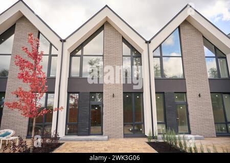 Fronts of modern houses lined up to each other Stock Photo - Alamy