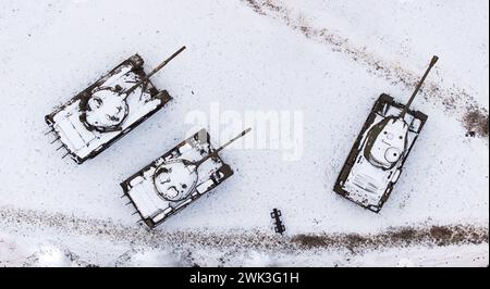 Aerial view of snow-clad tanks, artillery, and a jet fighter in Poznań ...