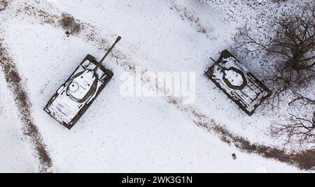 Aerial view of snow-clad tanks, artillery, armored vehicles, military ...