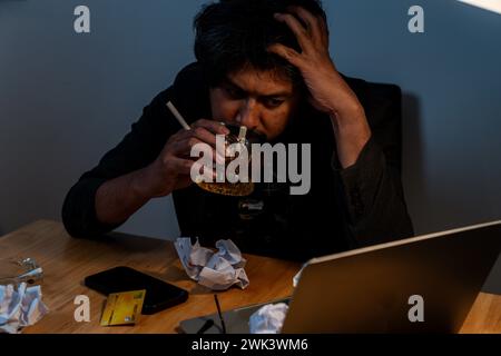 Businessperson experiencing failure and drinking alcohol Stock Photo ...