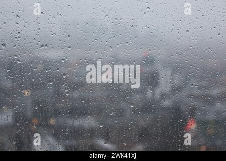A photograph of London cityscape through a window covered in raindrops ...