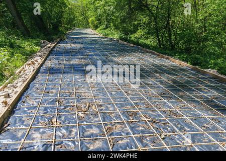 Construction of bicycle paths. Creating a sidewalk in the forest ...
