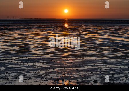 Sunset at low tide on the Nordstrand peninsula with a view of the ...