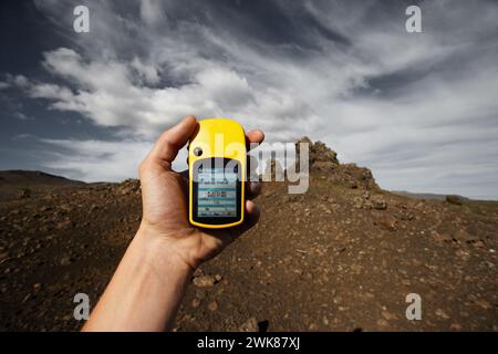 Hand Holding Yellow GPS Navigator, Reykjanes, Iceland Stock Photo - Alamy