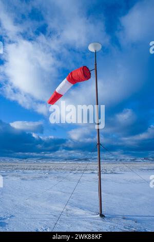 Windsock against beautiful blue sky with nice clouds Stock Photo - Alamy