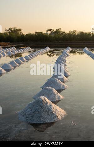 Piles of salt create geometric designs on the salt pan at a traditional ...
