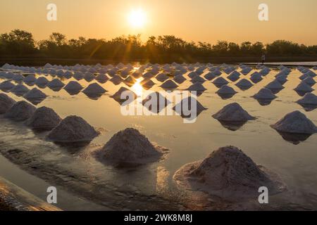 Piles of salt create geometric designs on the salt pan at a traditional ...