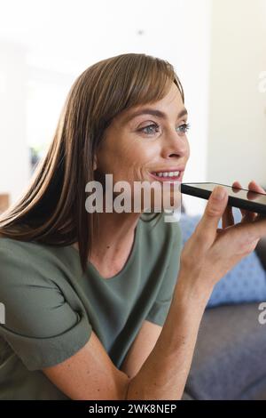 Woman Talking Using Voice Control And Assistant Stock Photo - Alamy