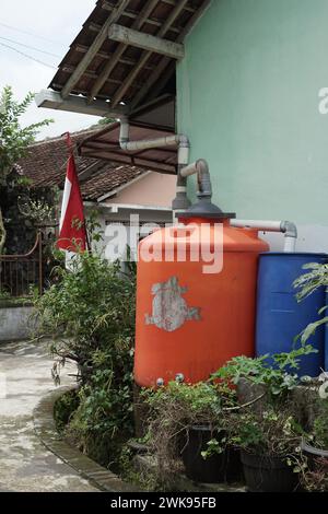 Rainwater storage tank installed outside the house Stock Photo - Alamy