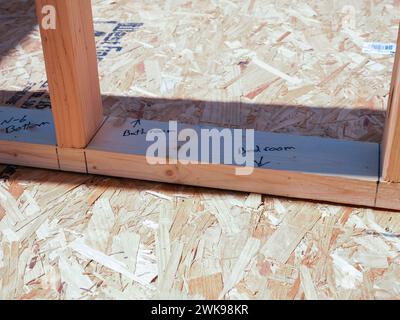 Post beam stud timber framing with marker on OSB sub flooring sheets ...