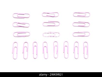 Purple paper clips on white background Stock Photo - Alamy