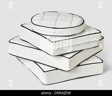 Stack of minimalist square and round white leather seat cushions Stock ...