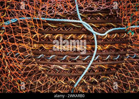 Netting and rope connected to rusted steel on fishing traps Stock Photo ...