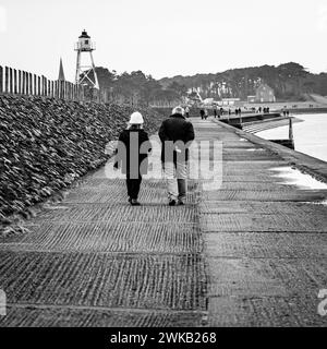 Walking along the sea defences at Silloth, Cumbria, England, UK Stock ...