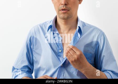 Shot of an unrecognizable man dressing himself with white background ...