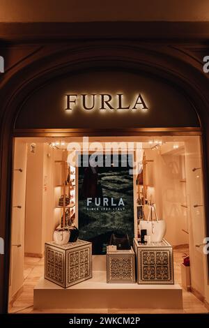 Furla luxury famous brand retail shop golden logo signboard on the ...