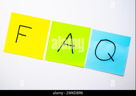 Colorful cards with FAQ, frequently asked questions written on them ...