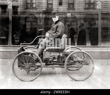 Henry Ford with the very first Ford Quadricycle of 1896 and nex to it ...